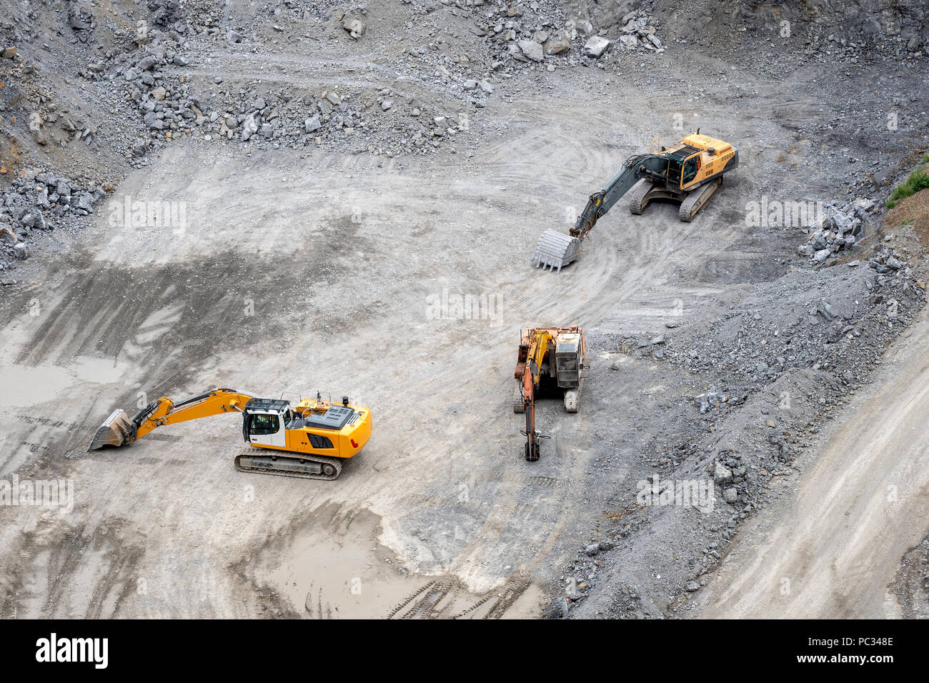 Mining in the granite quarry. Working mining machine - digger. Mining ...