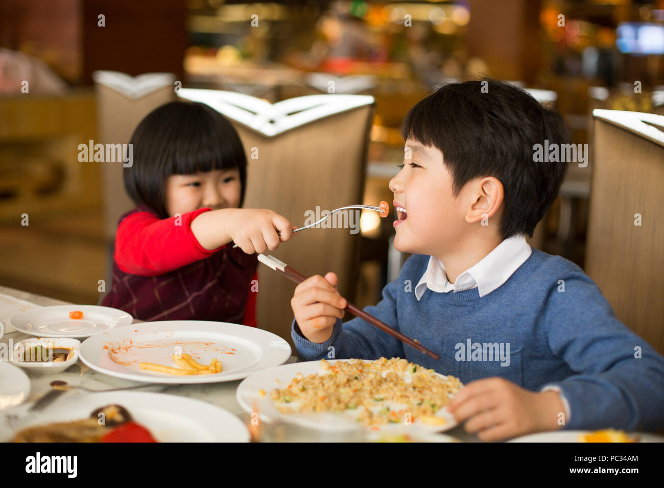 Indian child eating rice hi-res stock photography and images - Alamy
