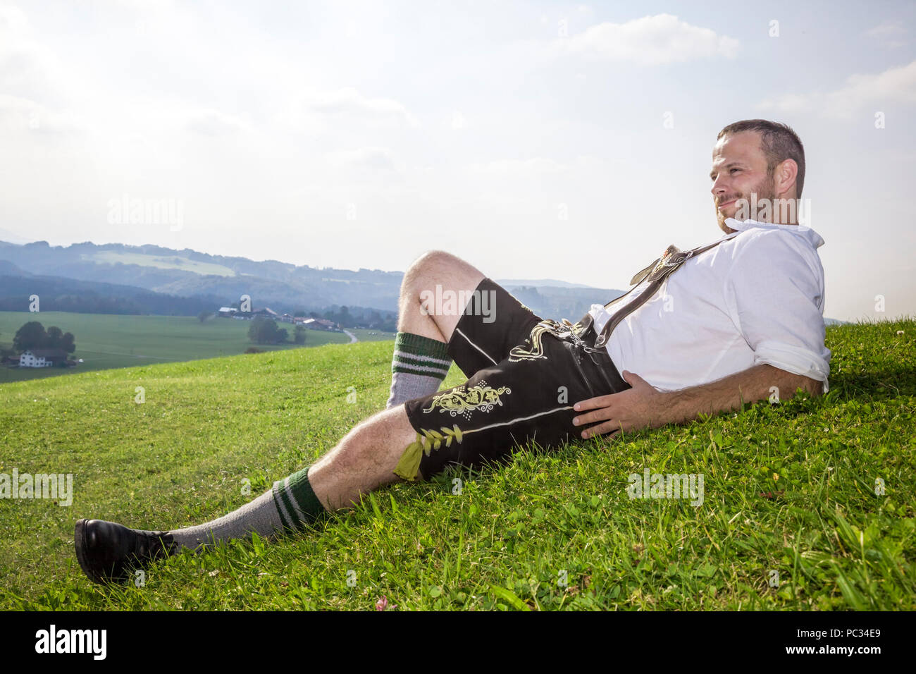 An image of a bavarian tradition man in the grass Stock Photo - Alamy