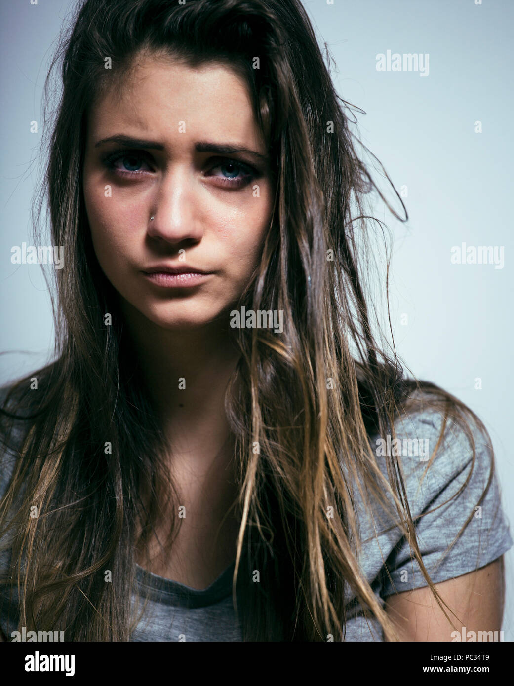 problem depressioned teenage with messed hair and sad face, junk Stock ...