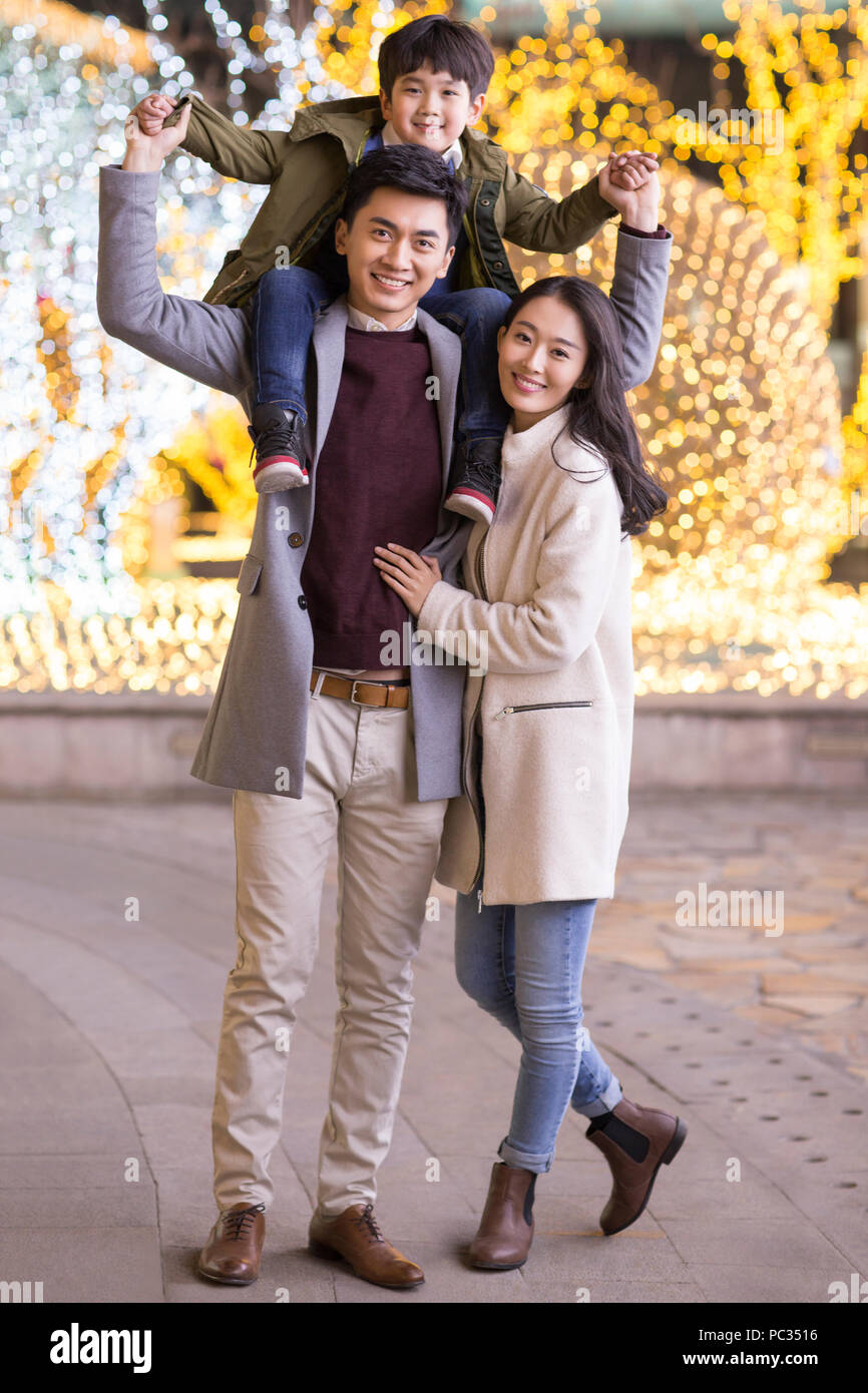Portrait of cheerful young Chinese family Stock Photo - Alamy