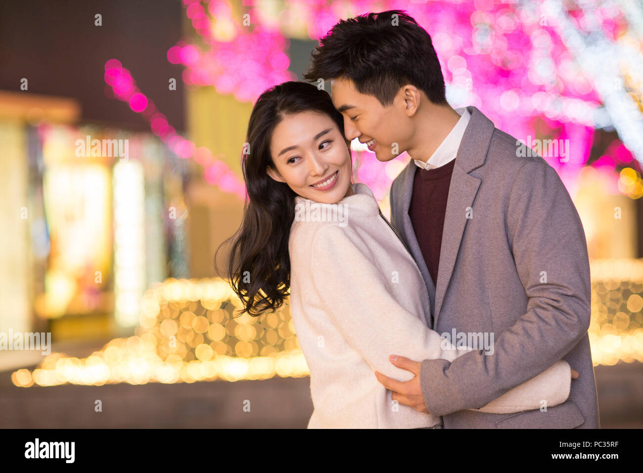 Young indian couple kissing hi-res stock photography and images - Alamy