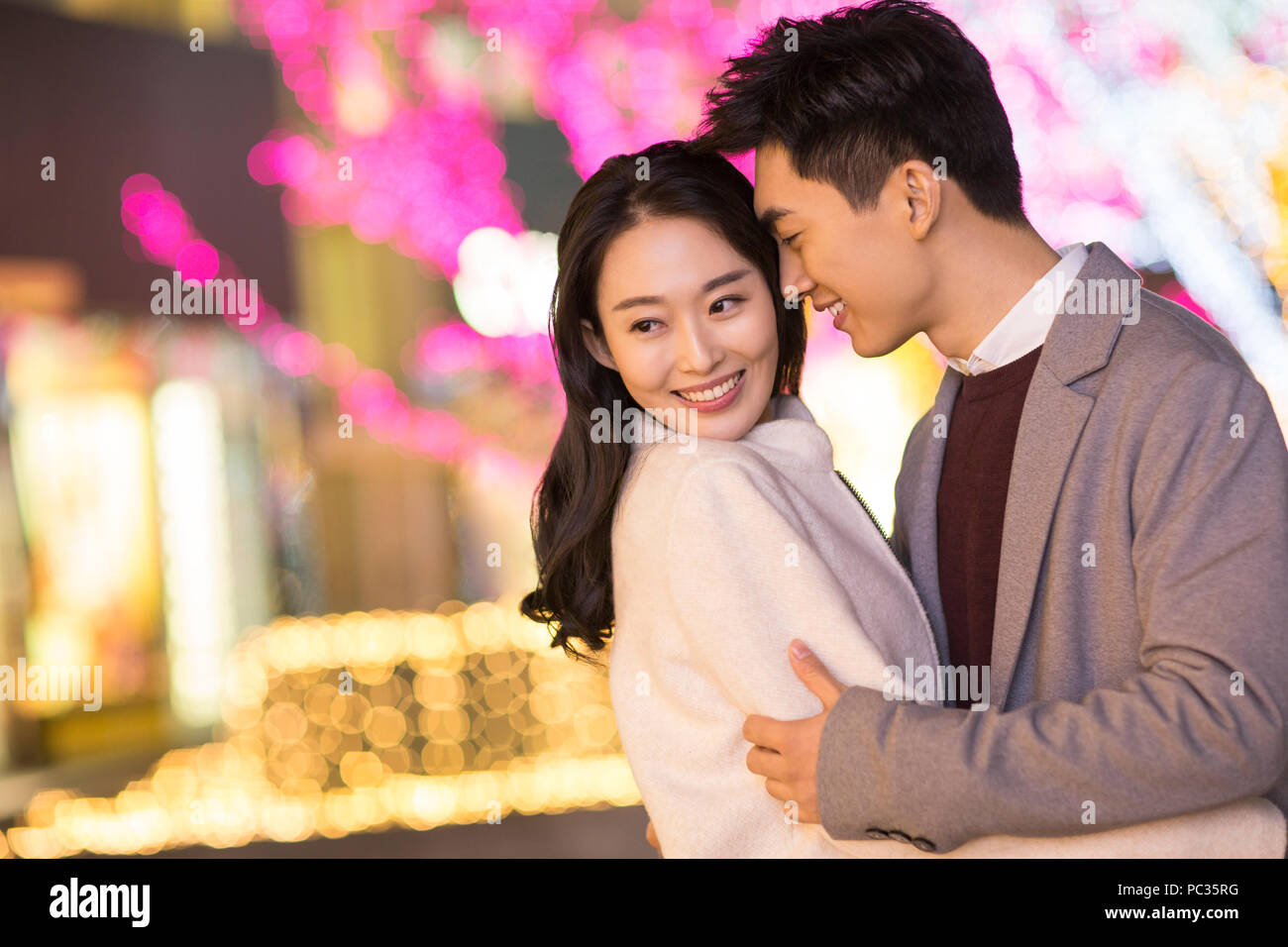 Young couple kissing in mall hi-res stock photography and images - Alamy