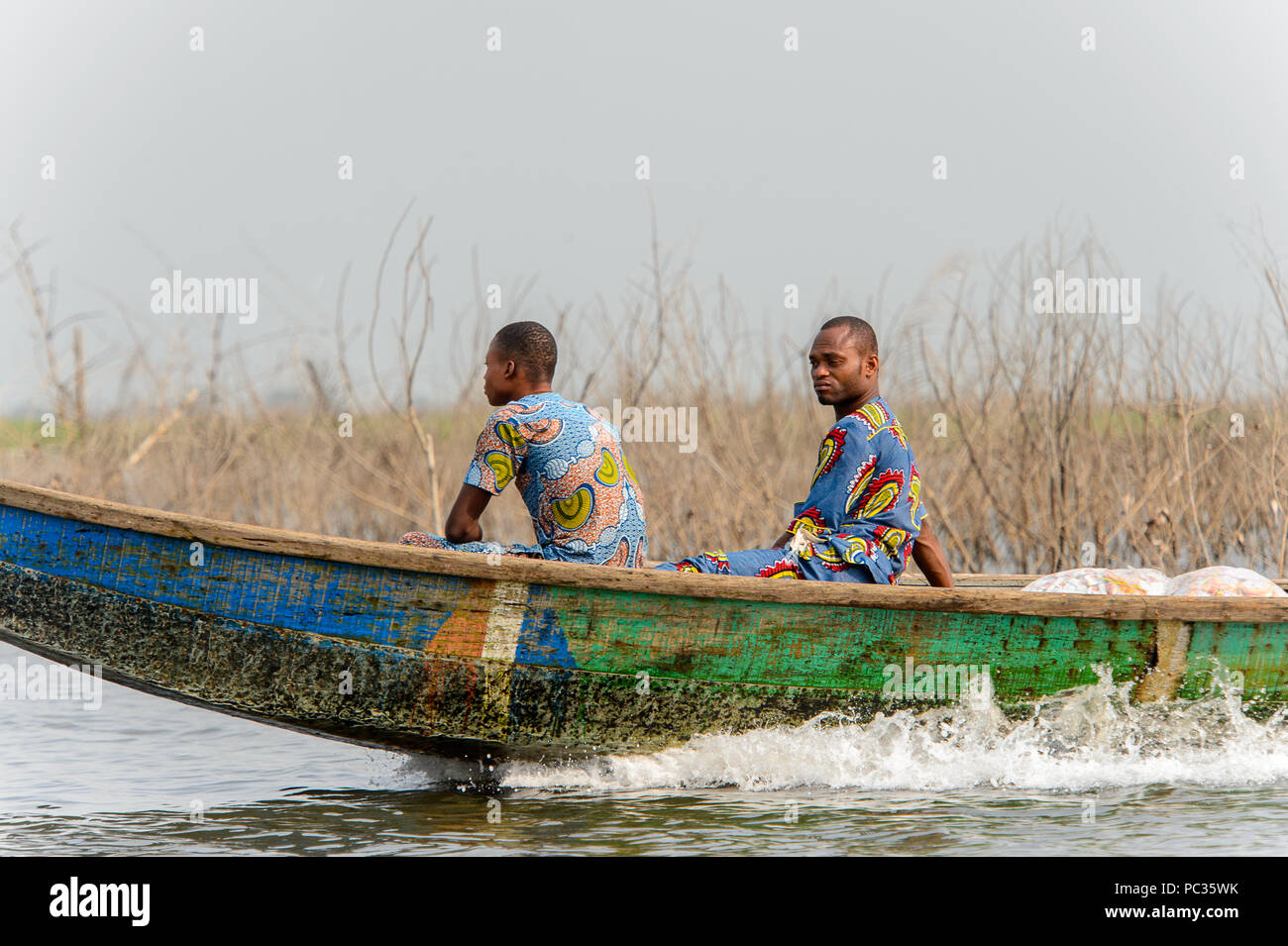 GANVIE, BENIN - JAN 11, 2017: Unidentified Beninese men sail in a ...