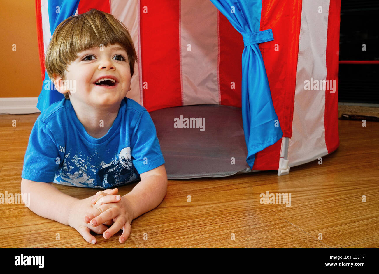 Montreal, Canada, July 28, 2018.Young boy playing inside his play tent ...
