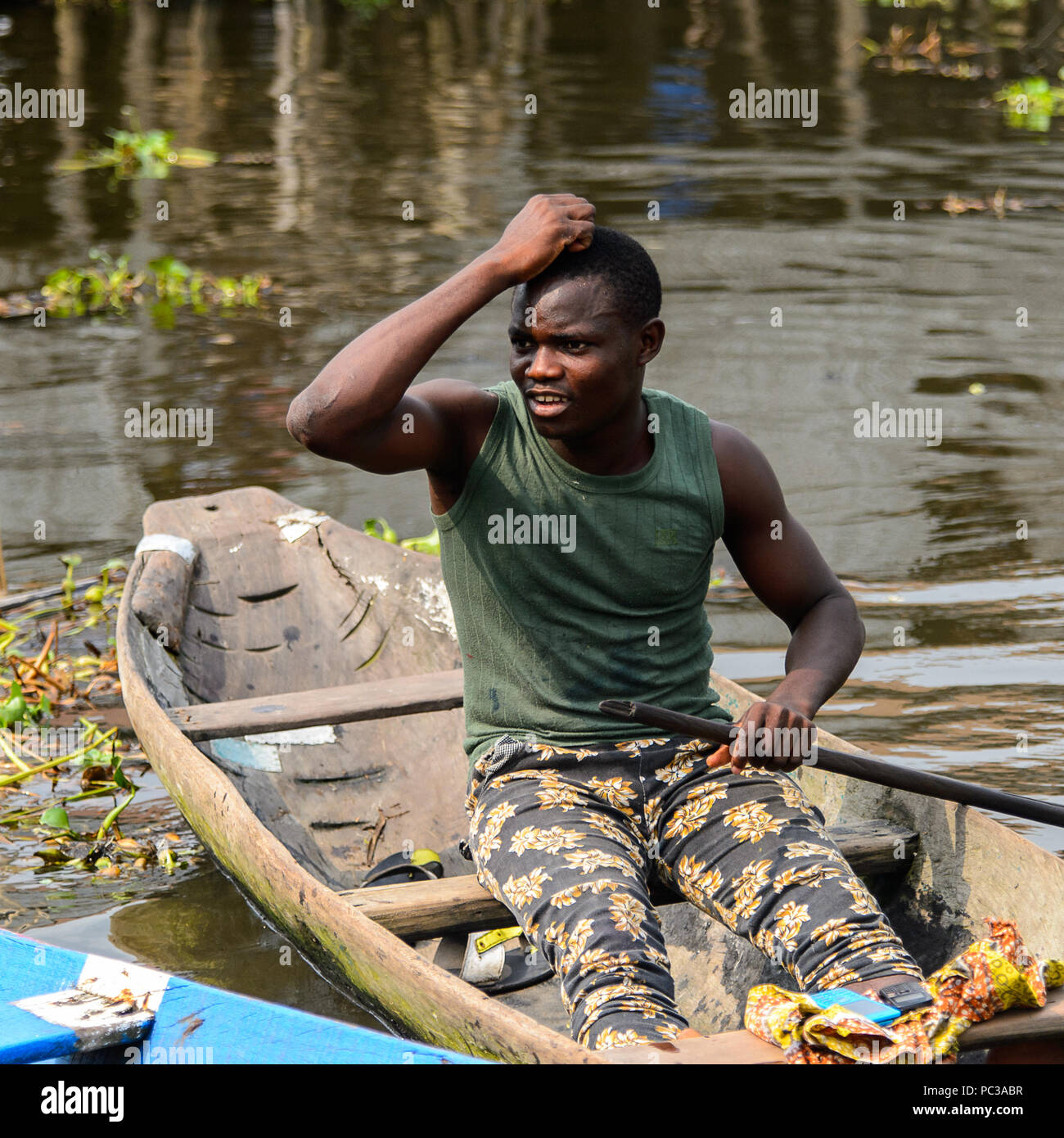 GANVIE, BENIN - JAN 11, 2017: Unidentified Beninese man sails in a ...