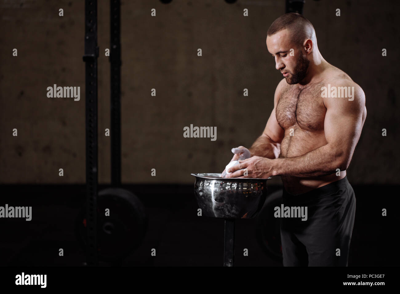 bodybuilder with white hands. useful thing for athlets. side view ...