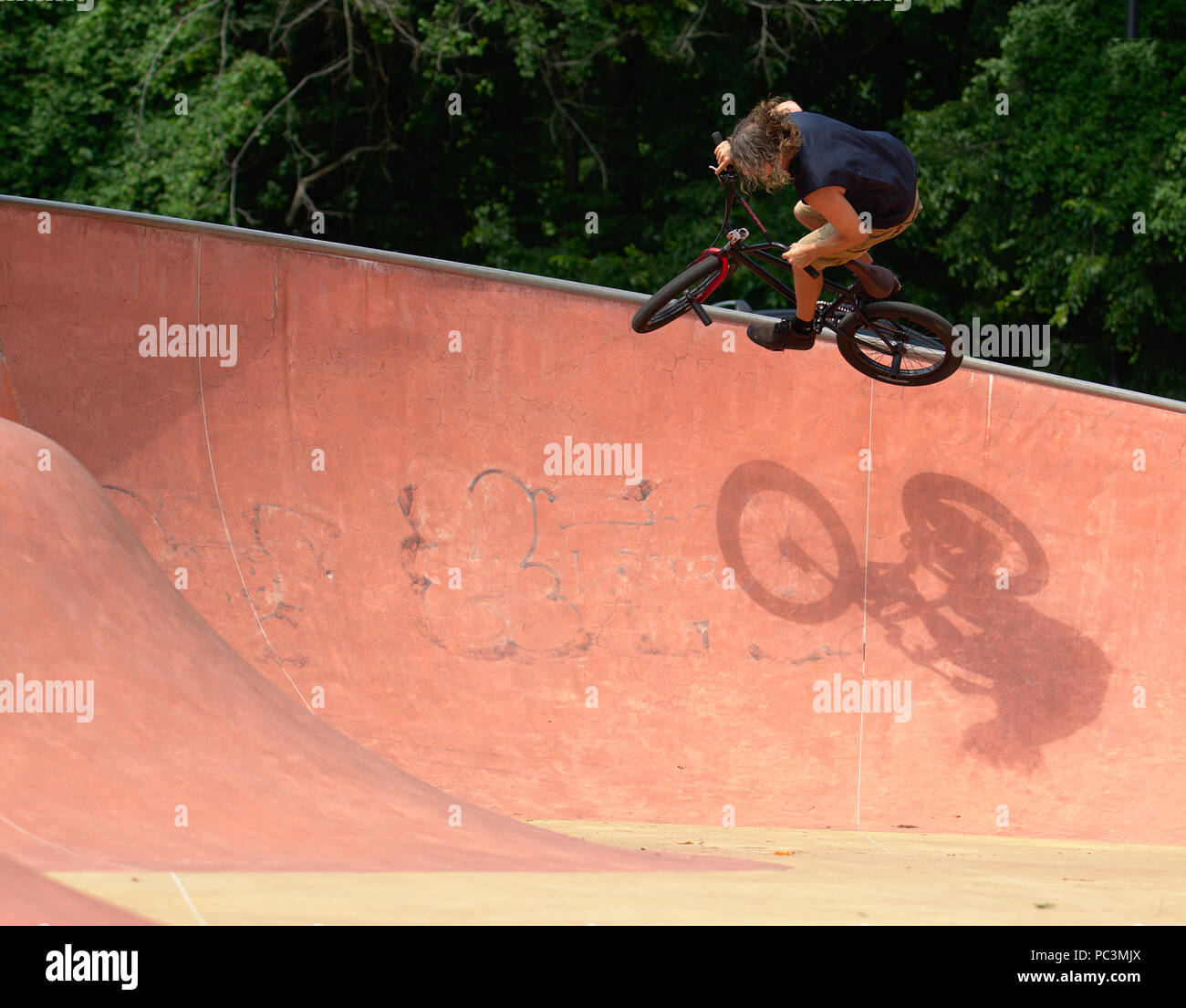 Man riding bike doing balance hi-res stock photography and images - Alamy