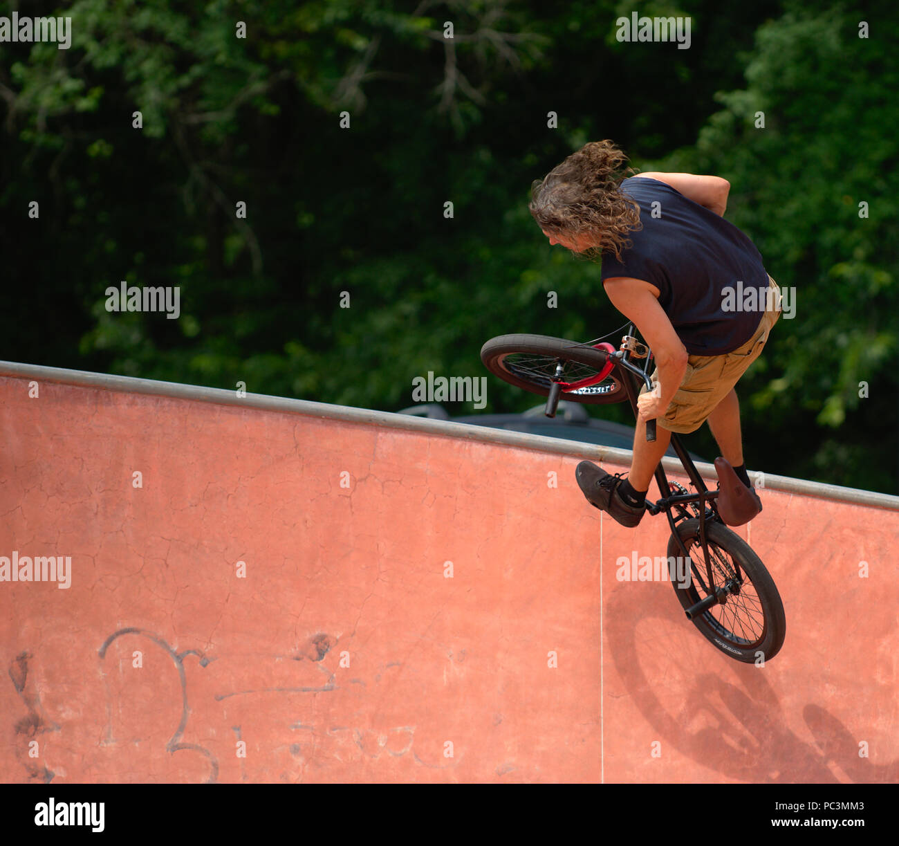 Man riding bike doing balance hi-res stock photography and images - Alamy