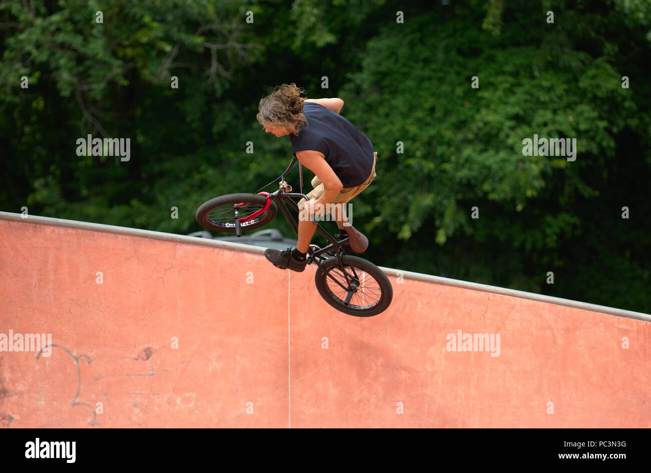Man riding bike doing balance hi-res stock photography and images - Alamy