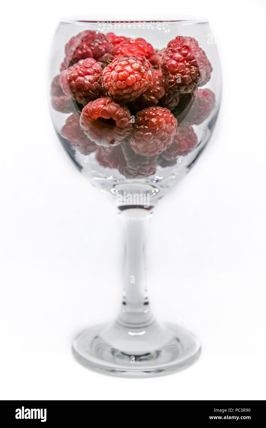 Ripe red raspberryes in the wine glass Stock Photo - Alamy