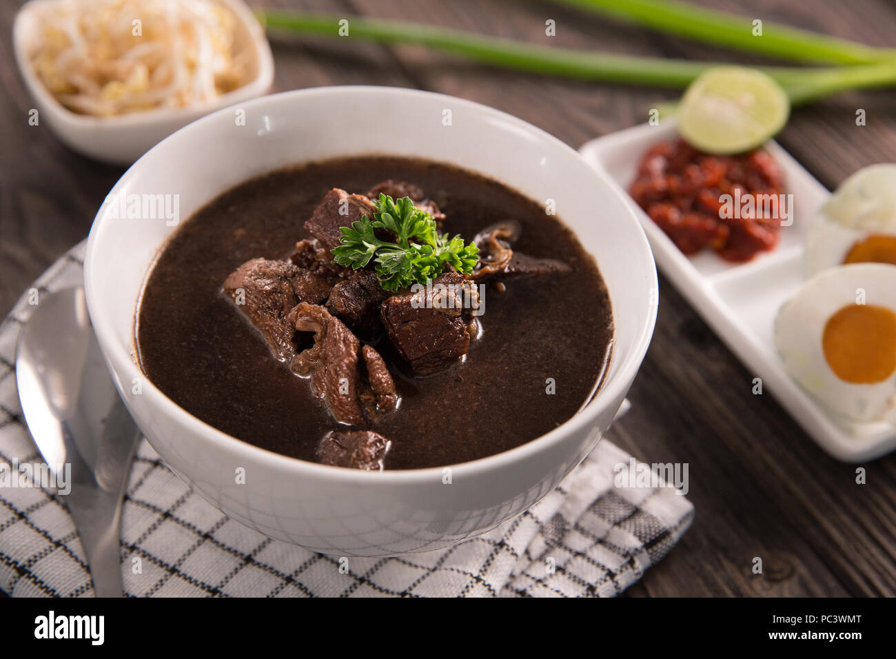 Rawon. traditional Indonesian beef black soup Stock Photo - Alamy
