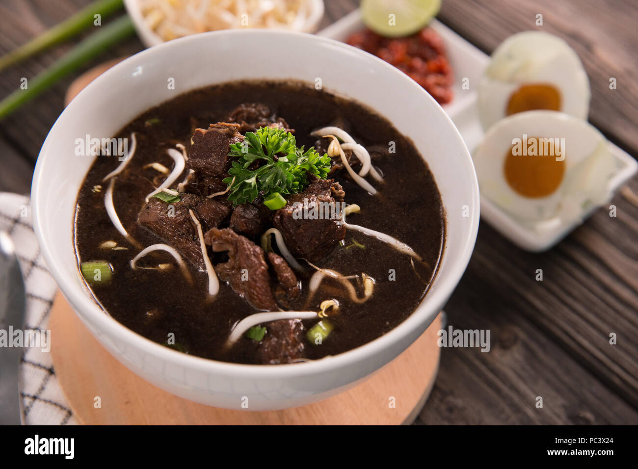Rawon. traditional Indonesian beef black soup Stock Photo - Alamy
