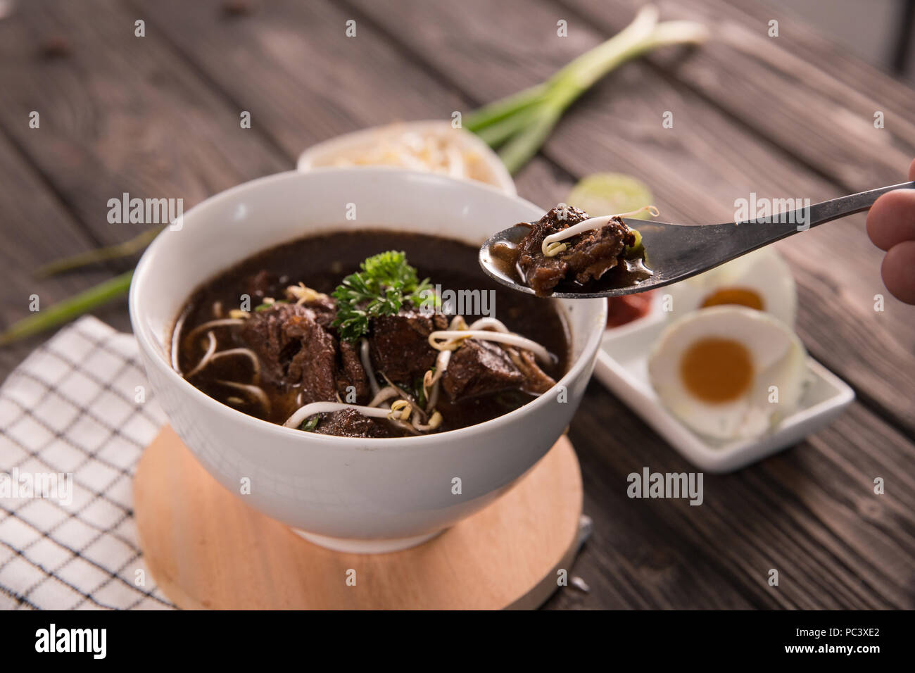 Rawon. traditional Indonesian beef black soup Stock Photo - Alamy