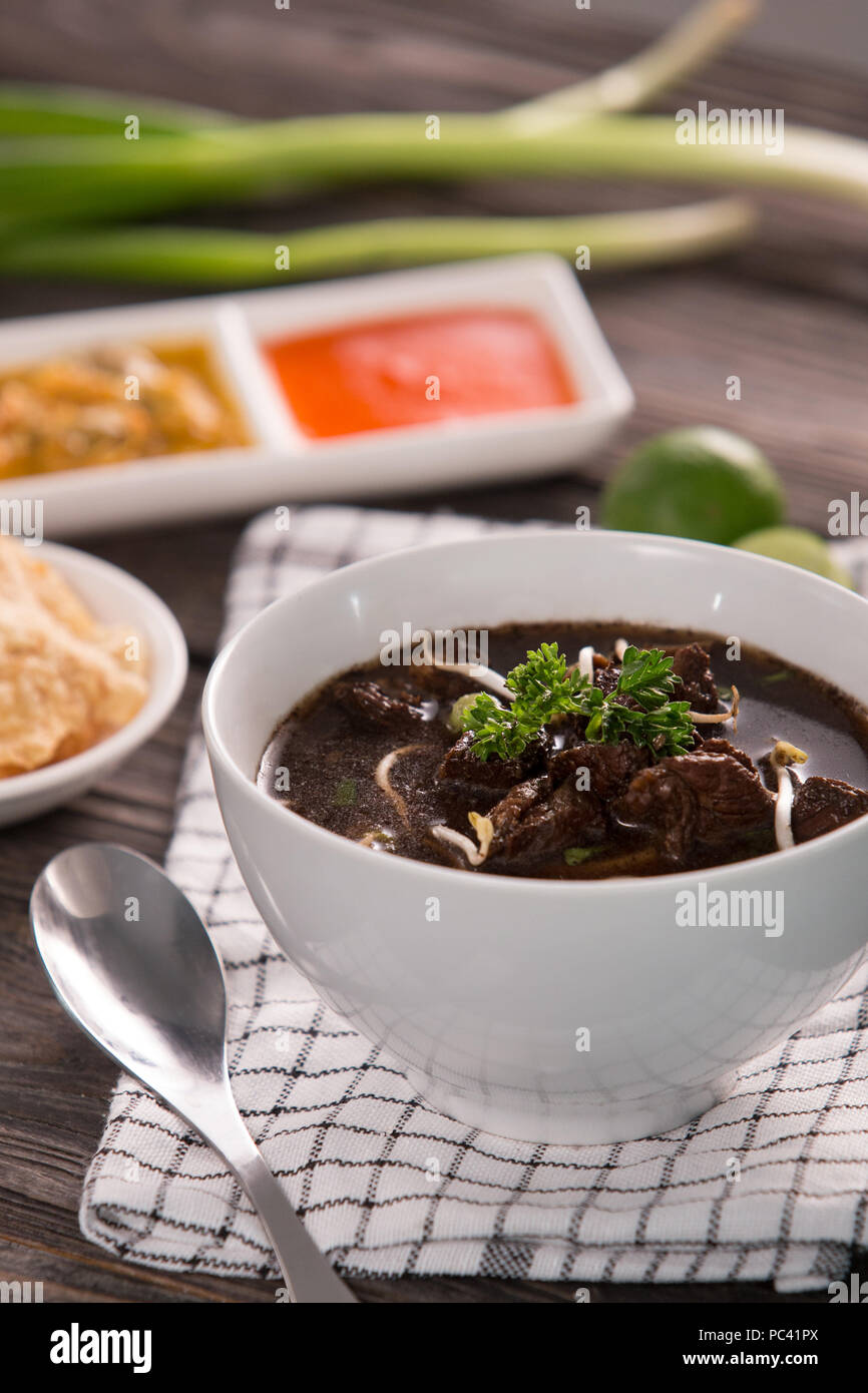 Rawon. traditional Indonesian beef black soup Stock Photo - Alamy
