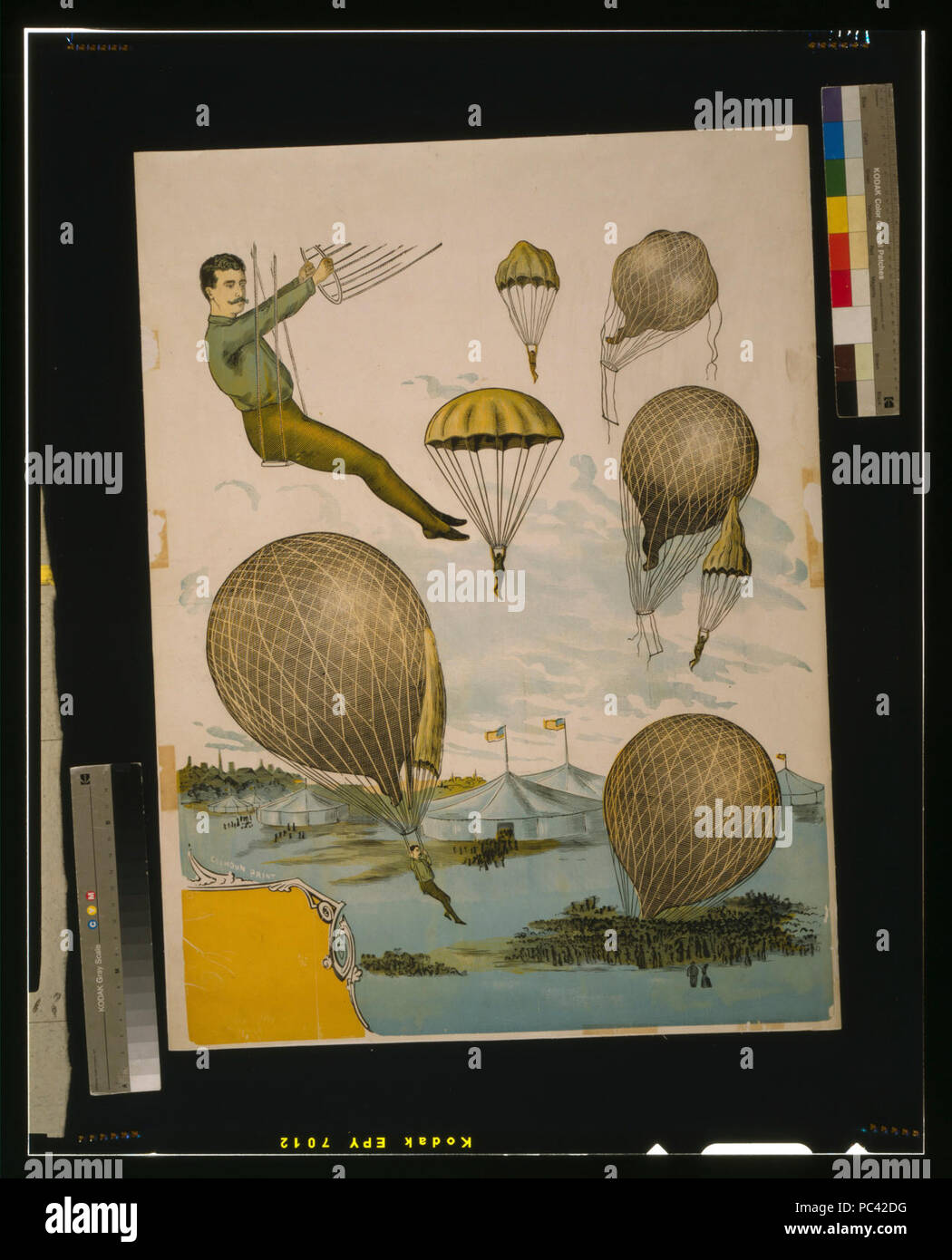 Aerial balloon performance with tents and audience below Stock Photo ...