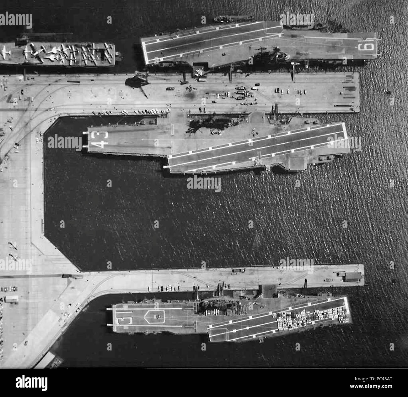 Aerial view of USS Hancock (CVA-19), USS Bon Homme Richard (CVA-31) and ...