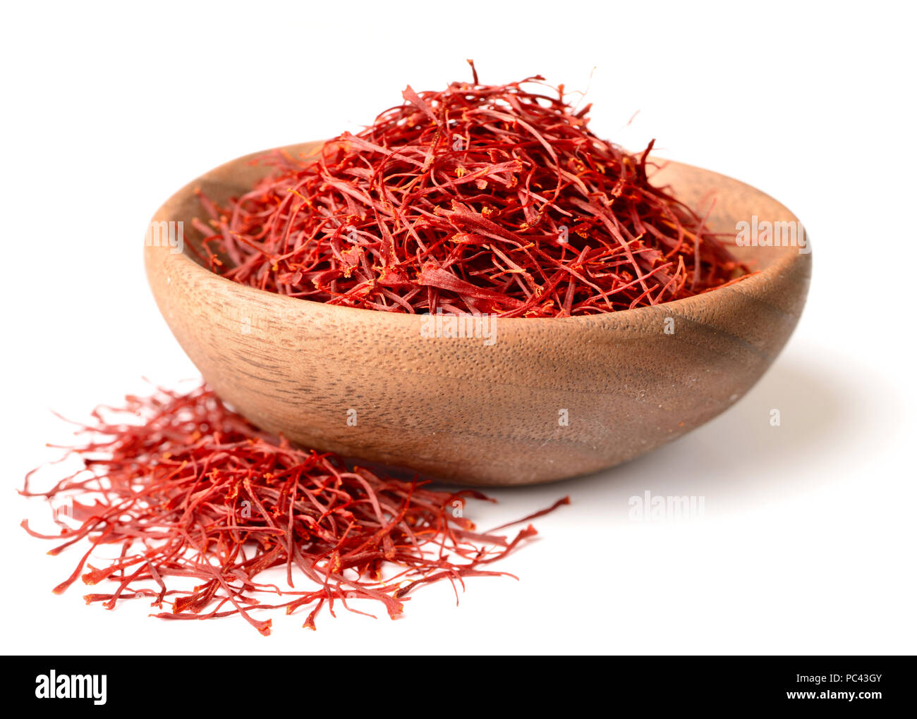 saffron thread in the wooden plate, isolated on white background Stock ...