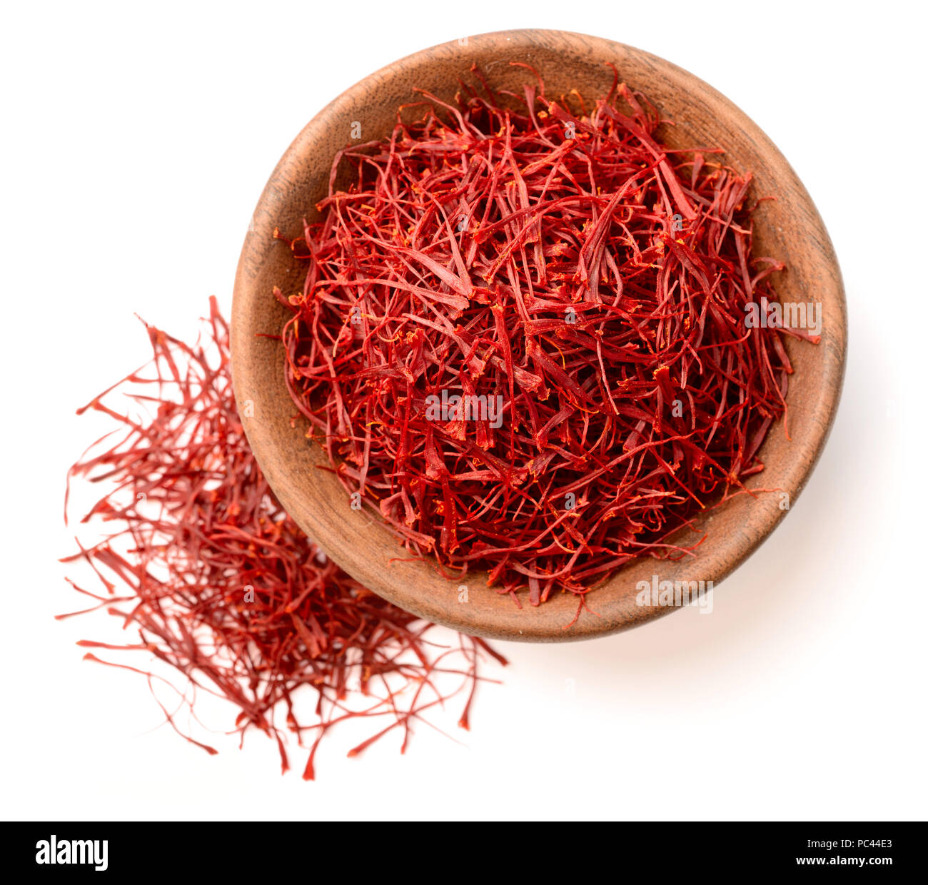 saffron thread in the wooden plate, isolated on white background Stock ...