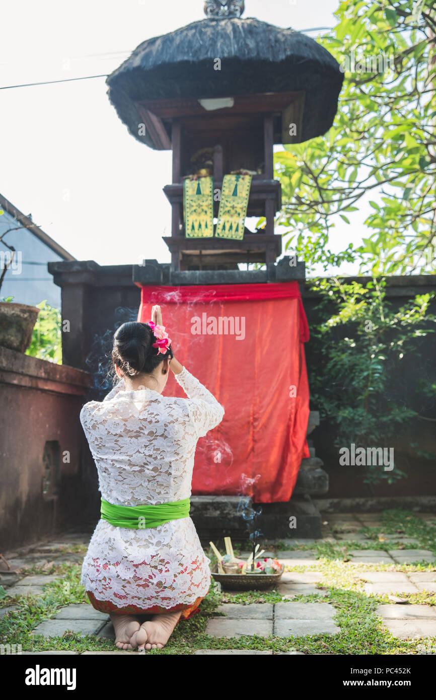 balinese woman praying at temple on small shrines in houses Stock Photo ...