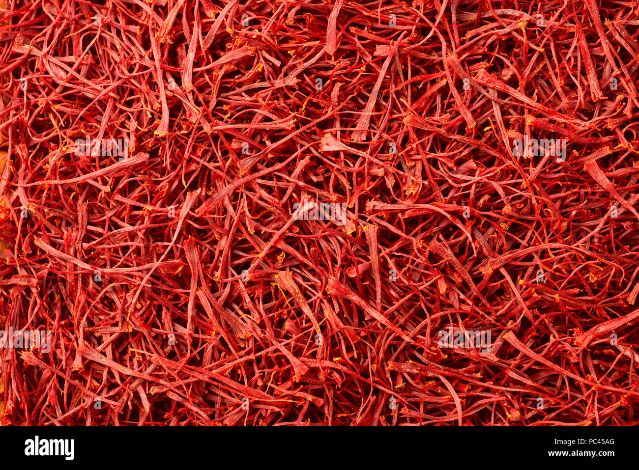 food background of red dried saffron thread spice Stock Photo - Alamy