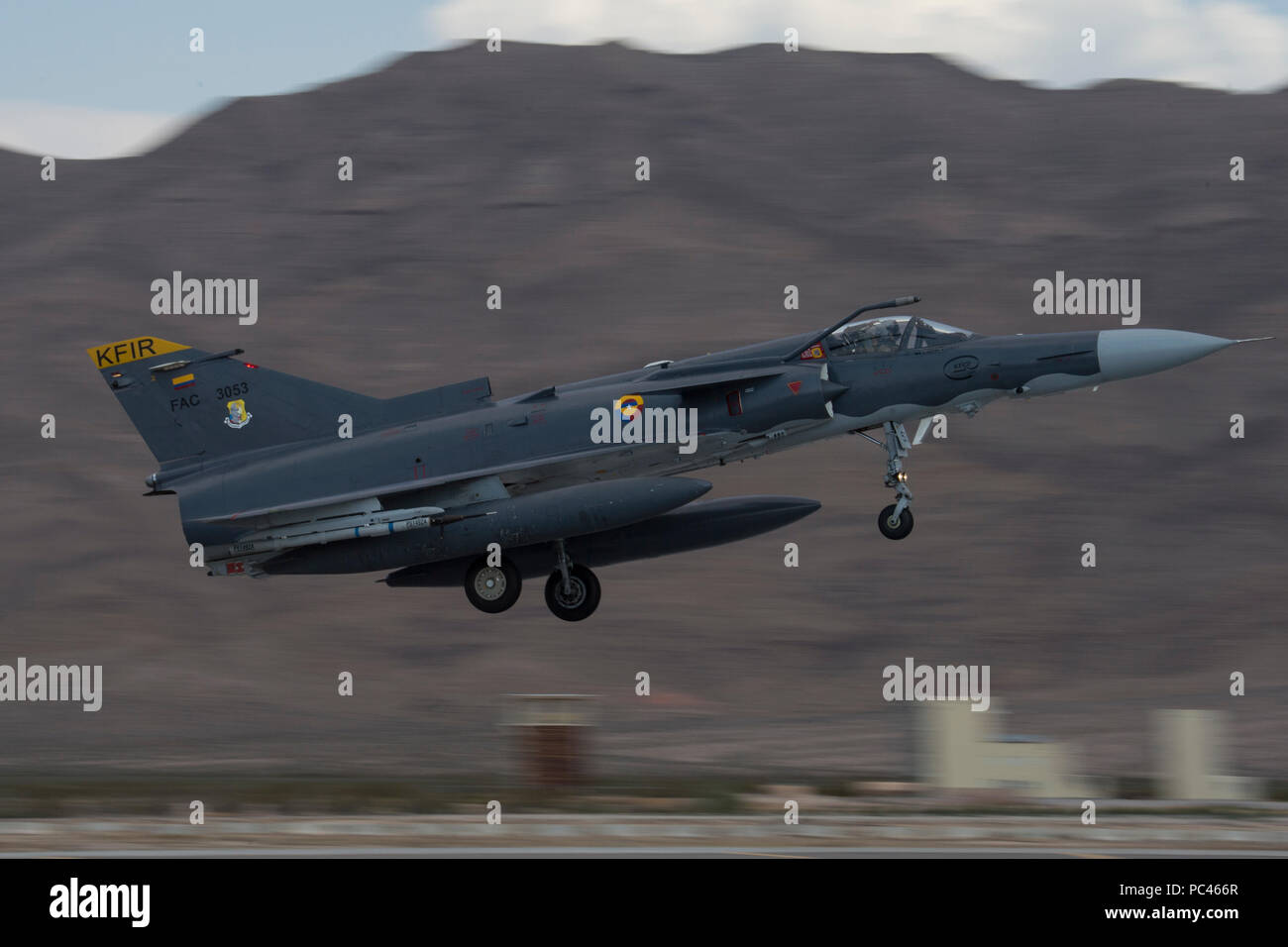 A Colombian Air Force Kfir fighter jet lands on the flightline at ...