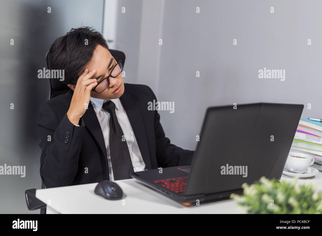 young business man working problem using laptop Stock Photo - Alamy