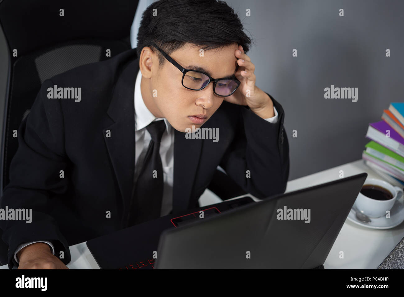 young business man working problem using laptop Stock Photo - Alamy