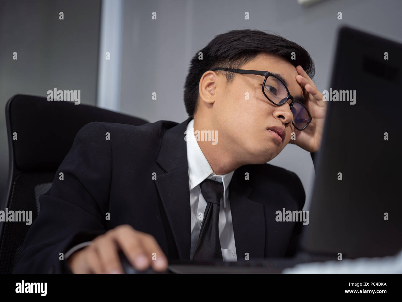 young business man working problem using laptop Stock Photo - Alamy