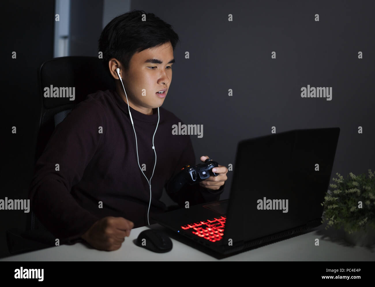 Stressed depressed young man using joystick to playing games Stock ...