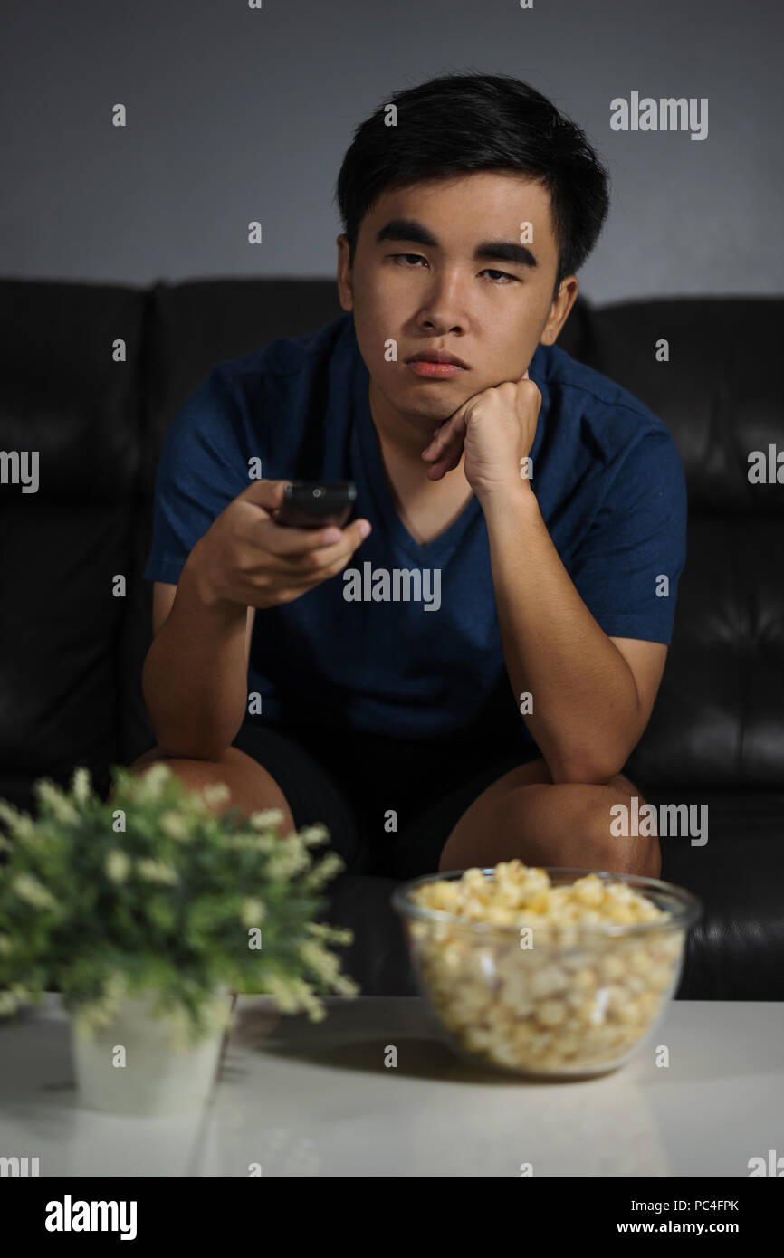 Bored guy sitting on couch hi-res stock photography and images - Alamy