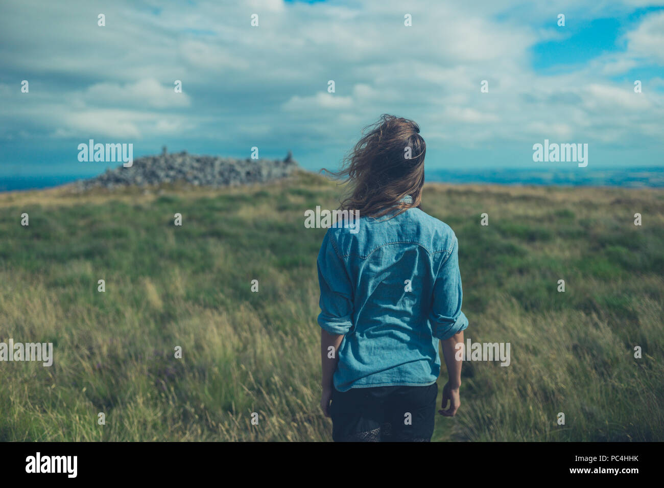 Female hiking hill windy hi-res stock photography and images - Alamy