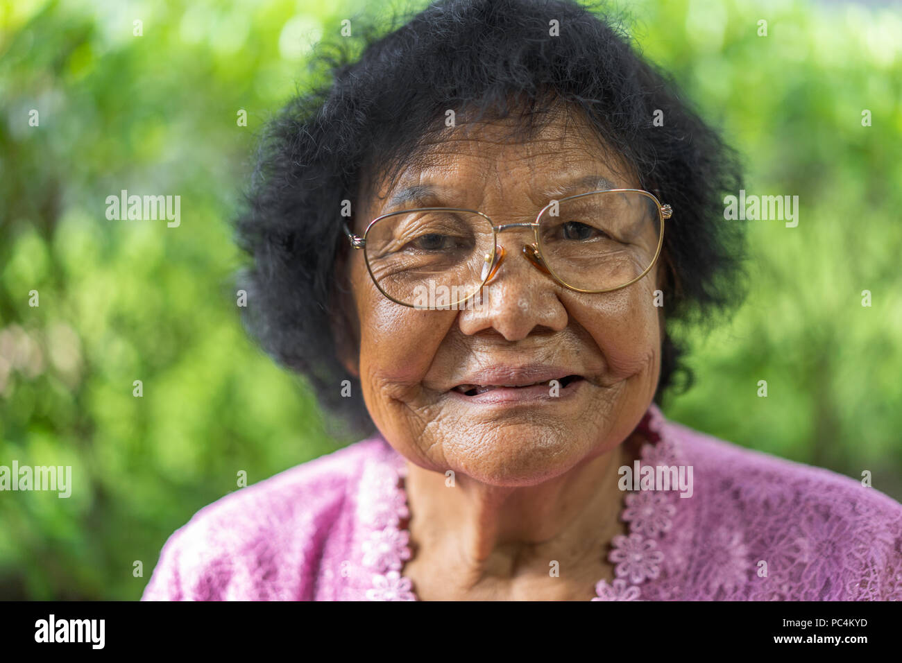 Happy smiling elderly lady wearing hi-res stock photography and images ...