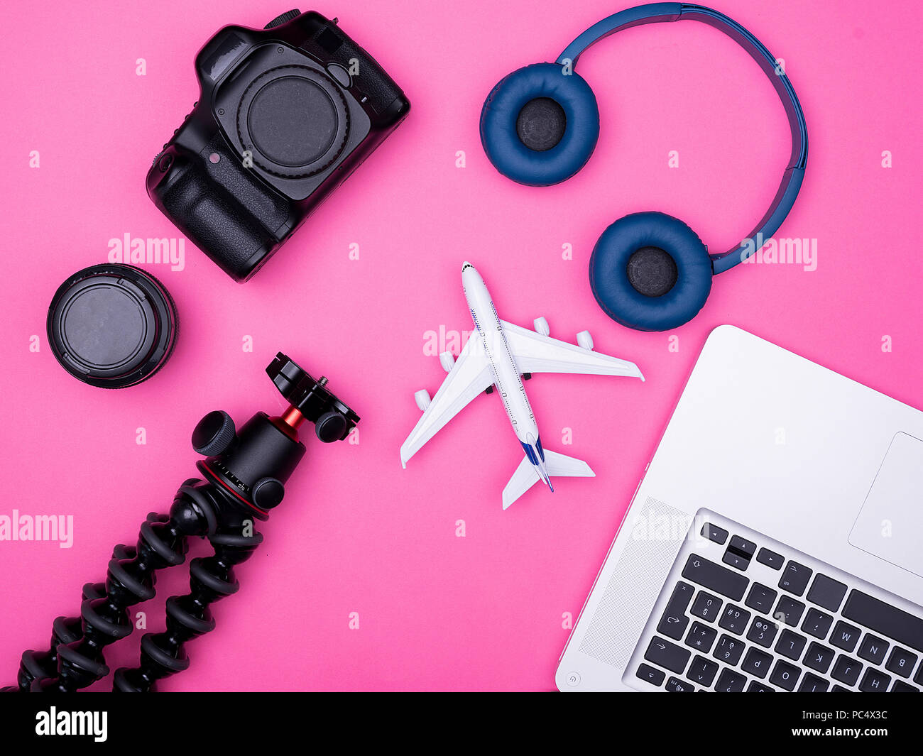 flat lay top view of traveler photographer accessories on pink ...
