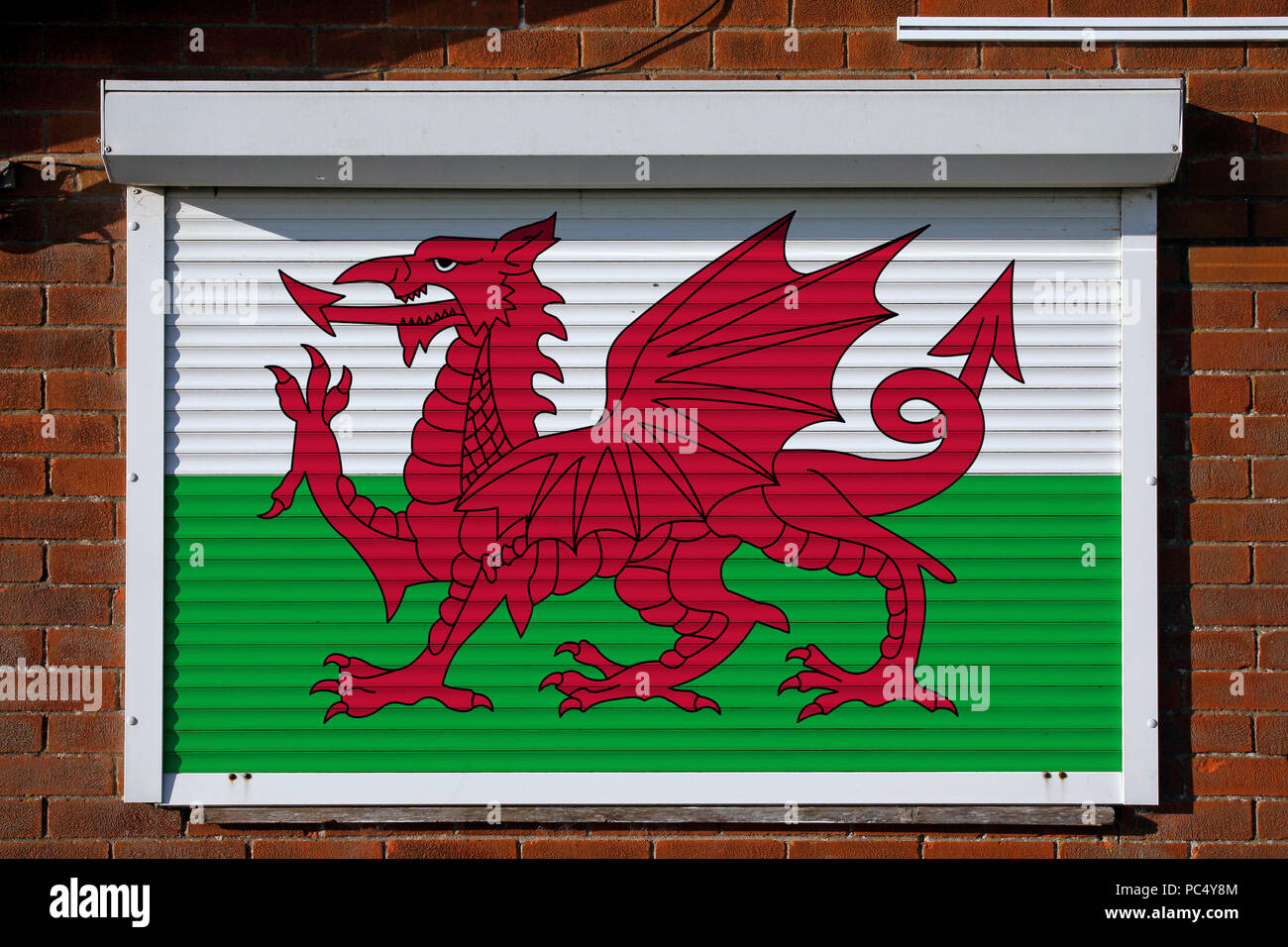 Welsh flag on closed steel security shutters Stock Photo - Alamy