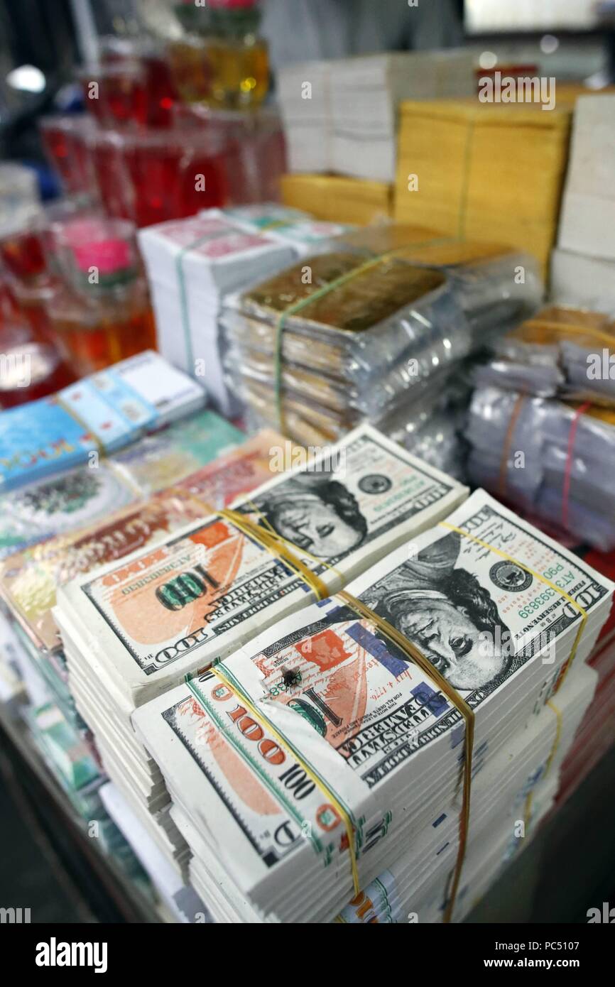 A shop selling Buddhist offerings for the temples. Hell bank notes and ...