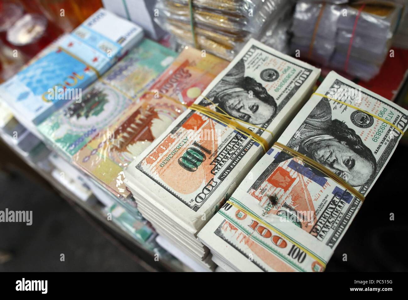 A shop selling Buddhist offerings for the temples. Hell bank notes and ...