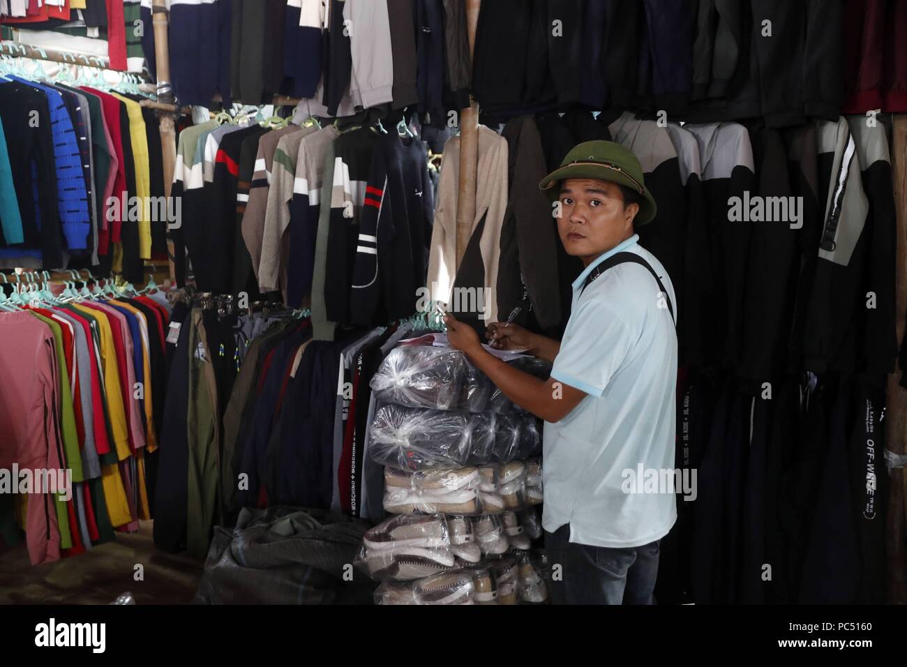 Stalls selling cloth in Van Quan market. Van Quan. Vietnam. | usage ...