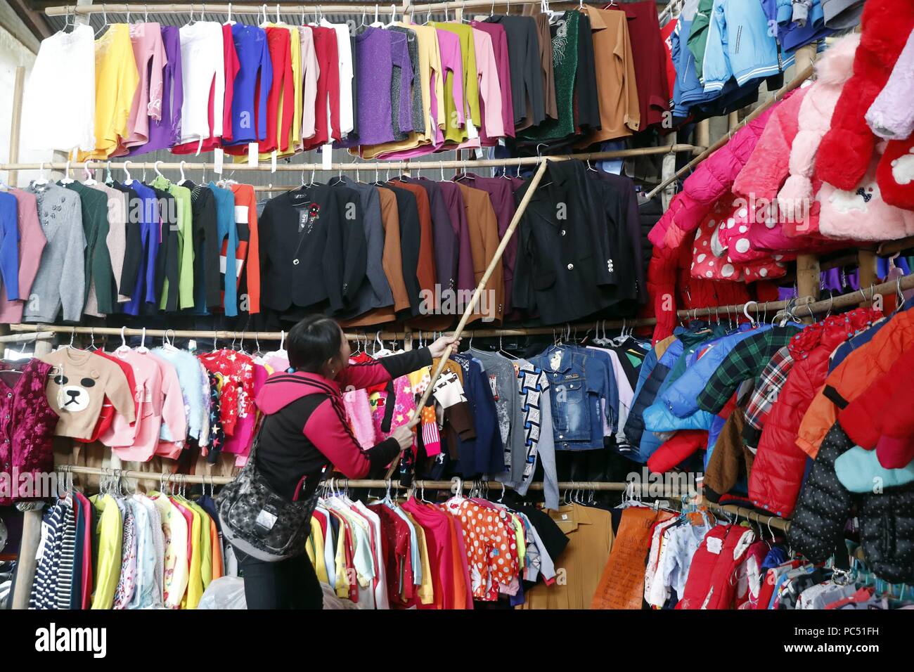Stalls selling cloth in Van Quan market. Van Quan. Vietnam. | usage ...