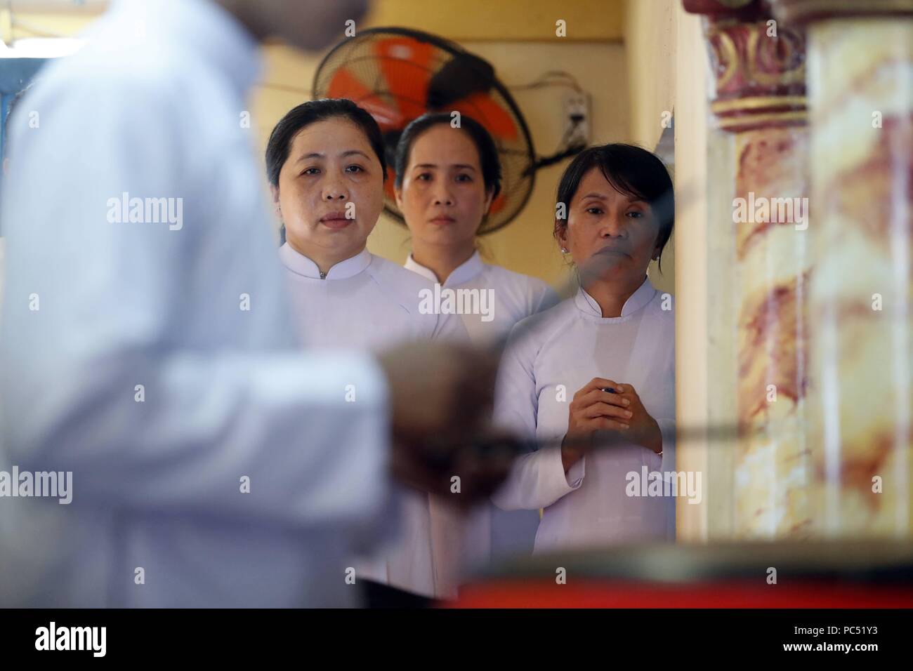 Cao Dai temple. Cao Dai worshipper play drums. Phu Quoc. Vietnam ...