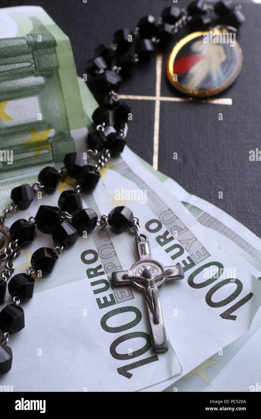 Money and religion. Prayer beads, bible and euros. | usage worldwide ...
