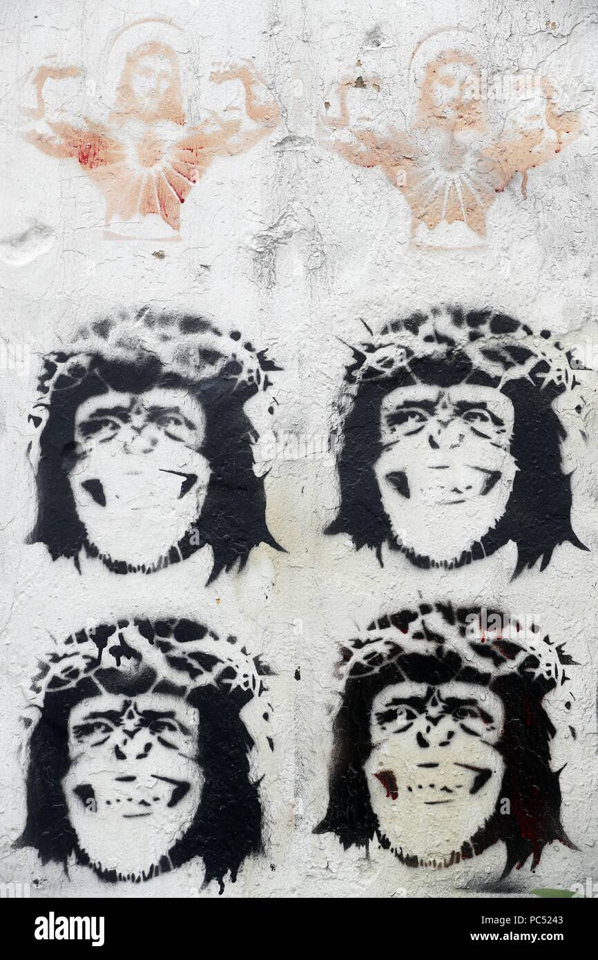 Stenciled image of Jesus Christ and monkeys wearing a crown of thorns ...