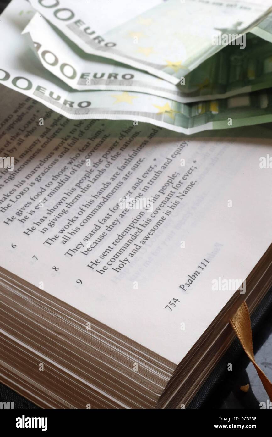 Money and religion. Holy bible and euros. | usage worldwide Stock Photo ...