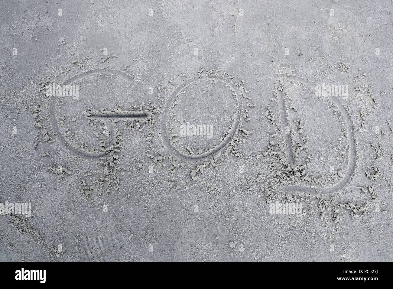 God word drawn in sand on beach. | usage worldwide Stock Photo - Alamy