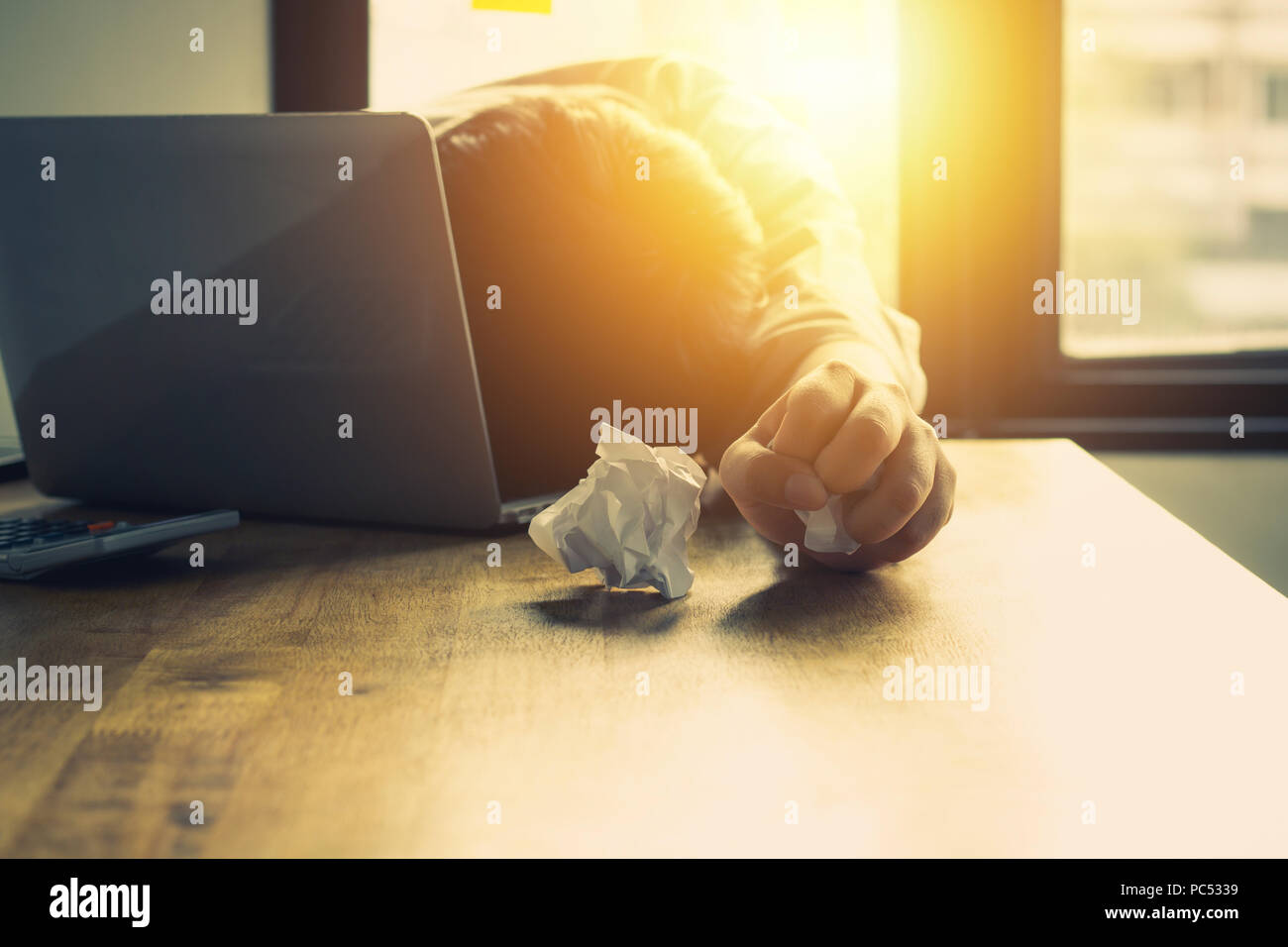 fail businessman sitting in front of notebook and serious about ...