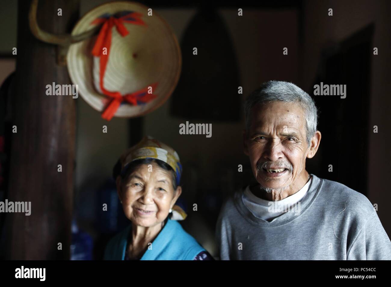 Bahnar (Ba Na) ethnic group. An old couple inside their traditional ...