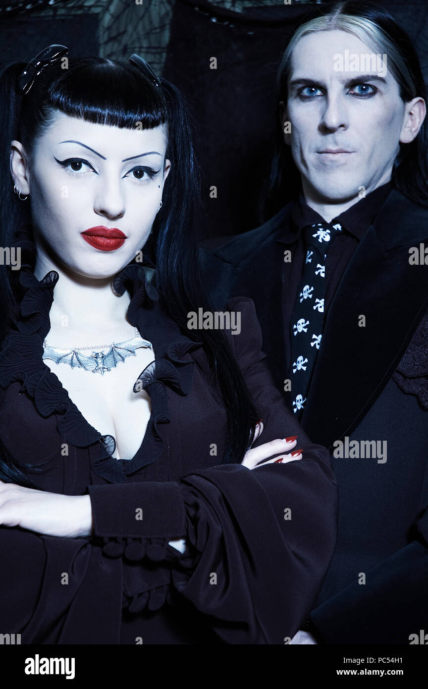 A gothic couple sitting in their home Stock Photo - Alamy