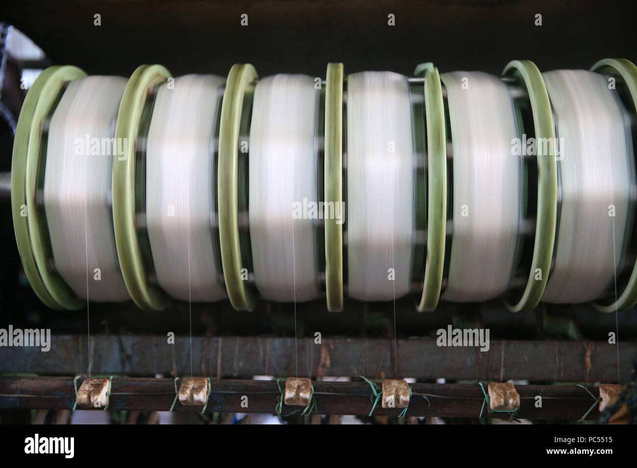 Traditional silk factory. Silk spinning machine at work. Dalat. Vietnam ...