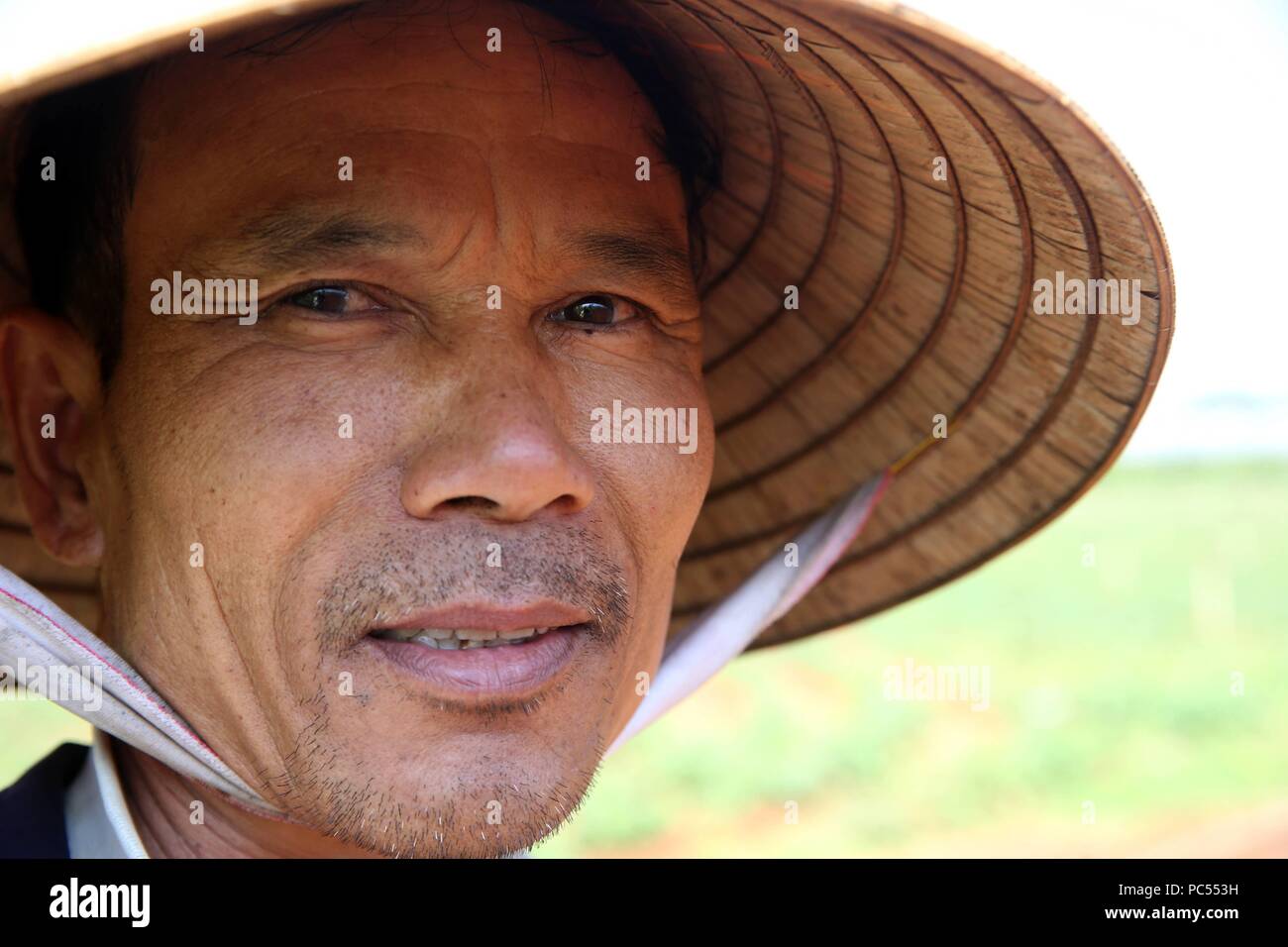 Farmer wearing traditional conical hat. Dalat. Vietnam. | usage ...
