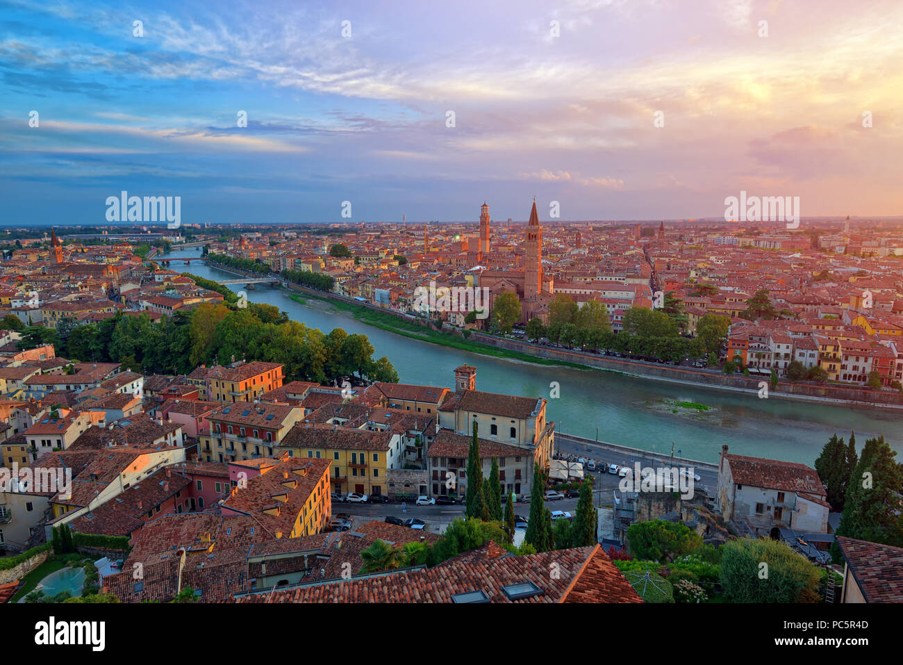 Panoramic aerial view of Verona, Italy at summer sunset, sun lens flare ...